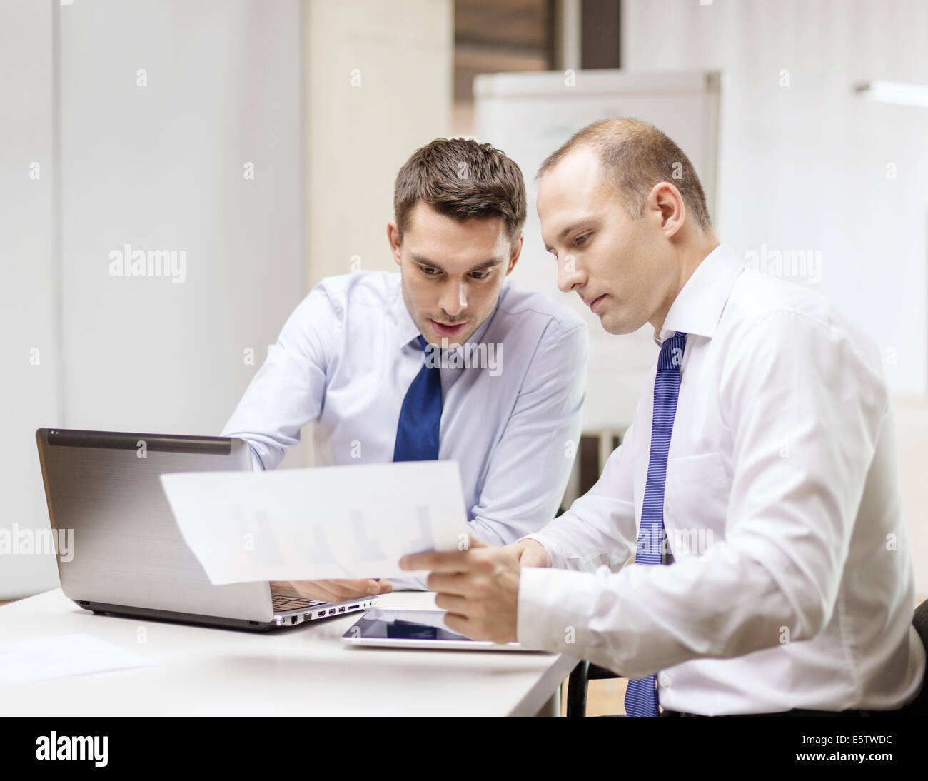 two businessmen having discussion in office Stock Photo - Alamy