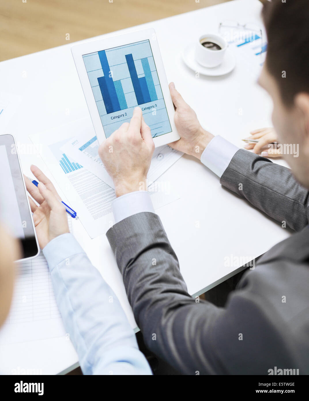 Businesspeople working on graph hi-res stock photography and images - Alamy