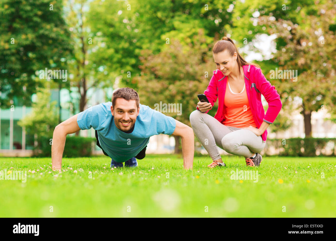 smiling man doing exercise outdoors Stock Photo - Alamy