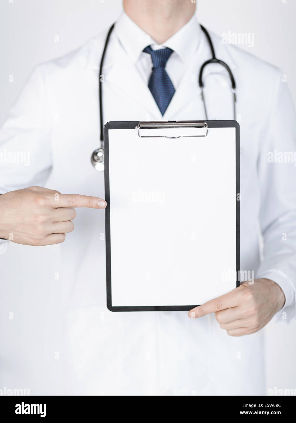 doctor pointing at blank white paper Stock Photo - Alamy