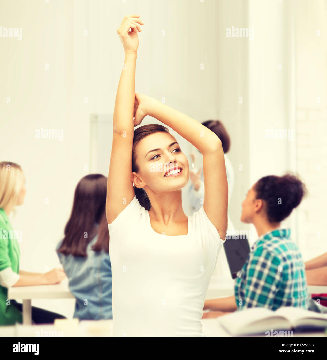 happy student girl with hands up Stock Photo - Alamy