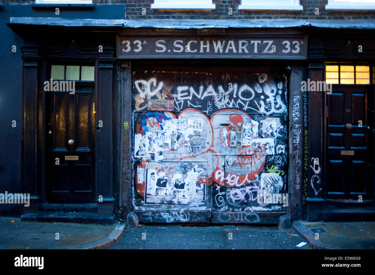 Old shop front covered in graffiti, Spitafields East London Stock Photo ...