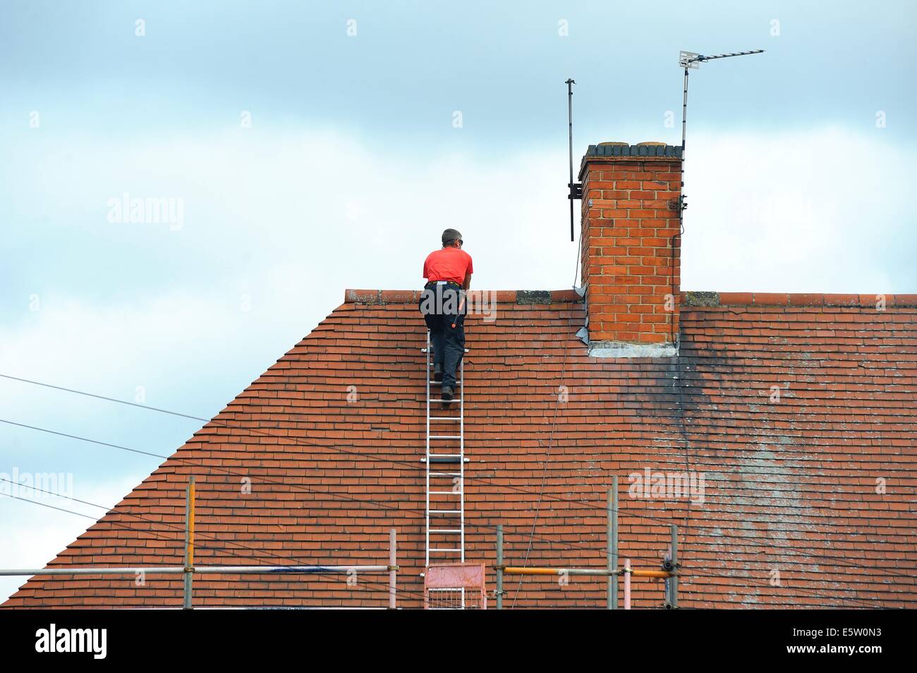 Person up ladder repair hi-res stock photography and images - Alamy