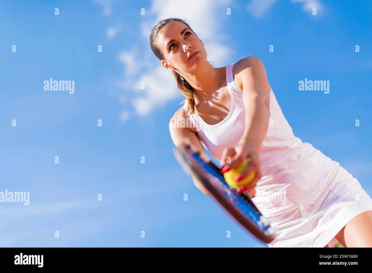 Young woman playing tennis Stock Photo - Alamy