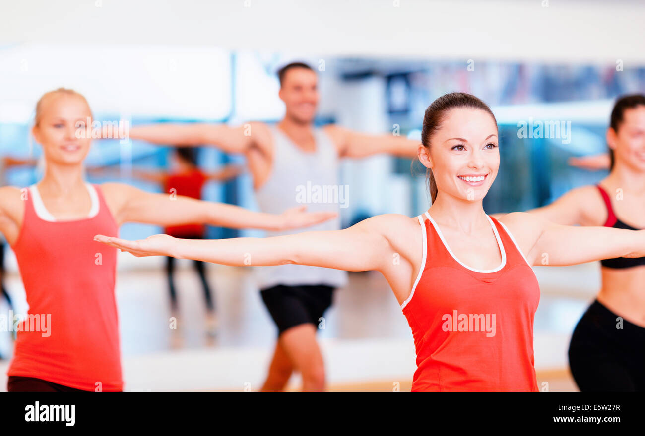 group of smiling people exercising in the gym Stock Photo - Alamy