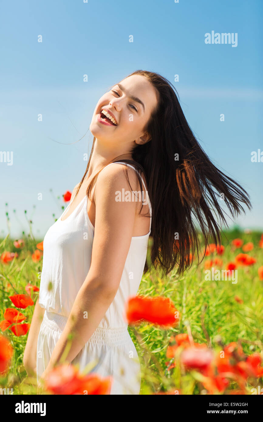 laughing young woman on poppy field Stock Photo - Alamy