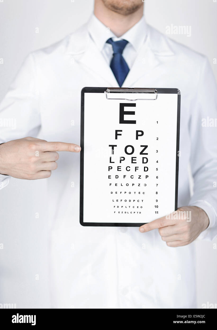 male ophthalmologist with eye chart Stock Photo - Alamy