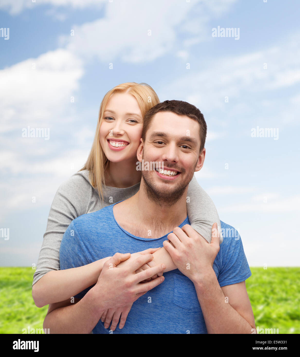 smiling couple hugging Stock Photo - Alamy