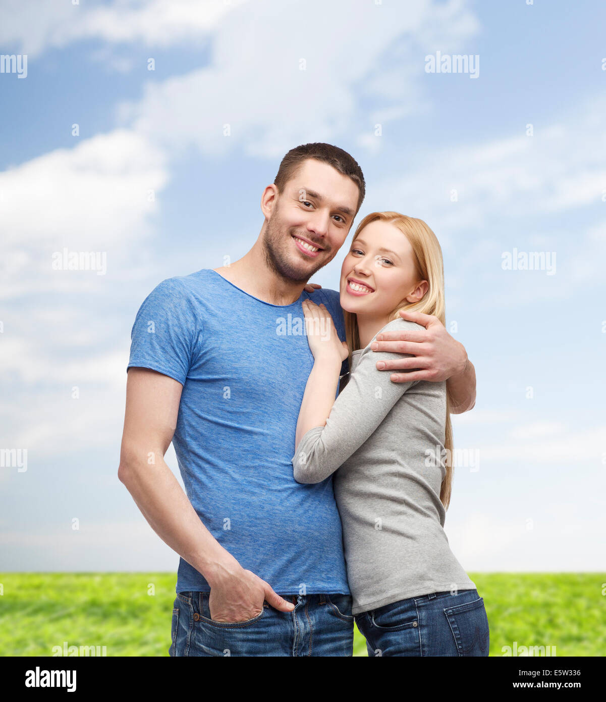smiling couple hugging Stock Photo - Alamy
