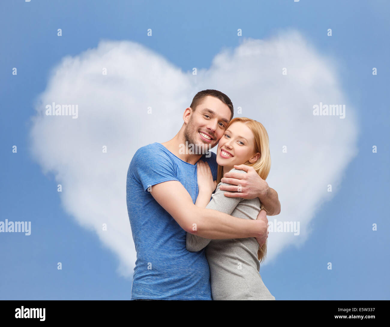 smiling couple hugging Stock Photo - Alamy