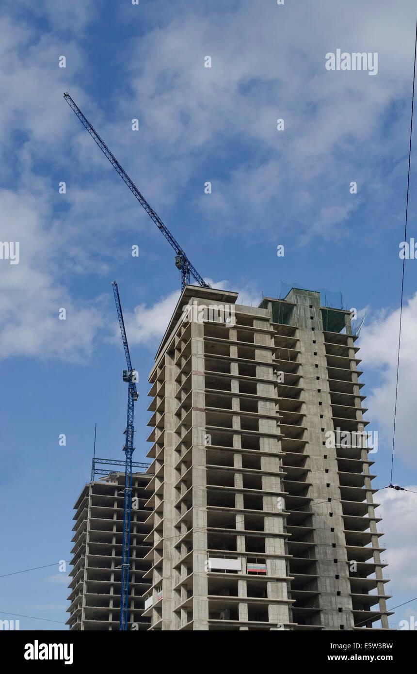Multistorey construction with jib-crane Stock Photo - Alamy