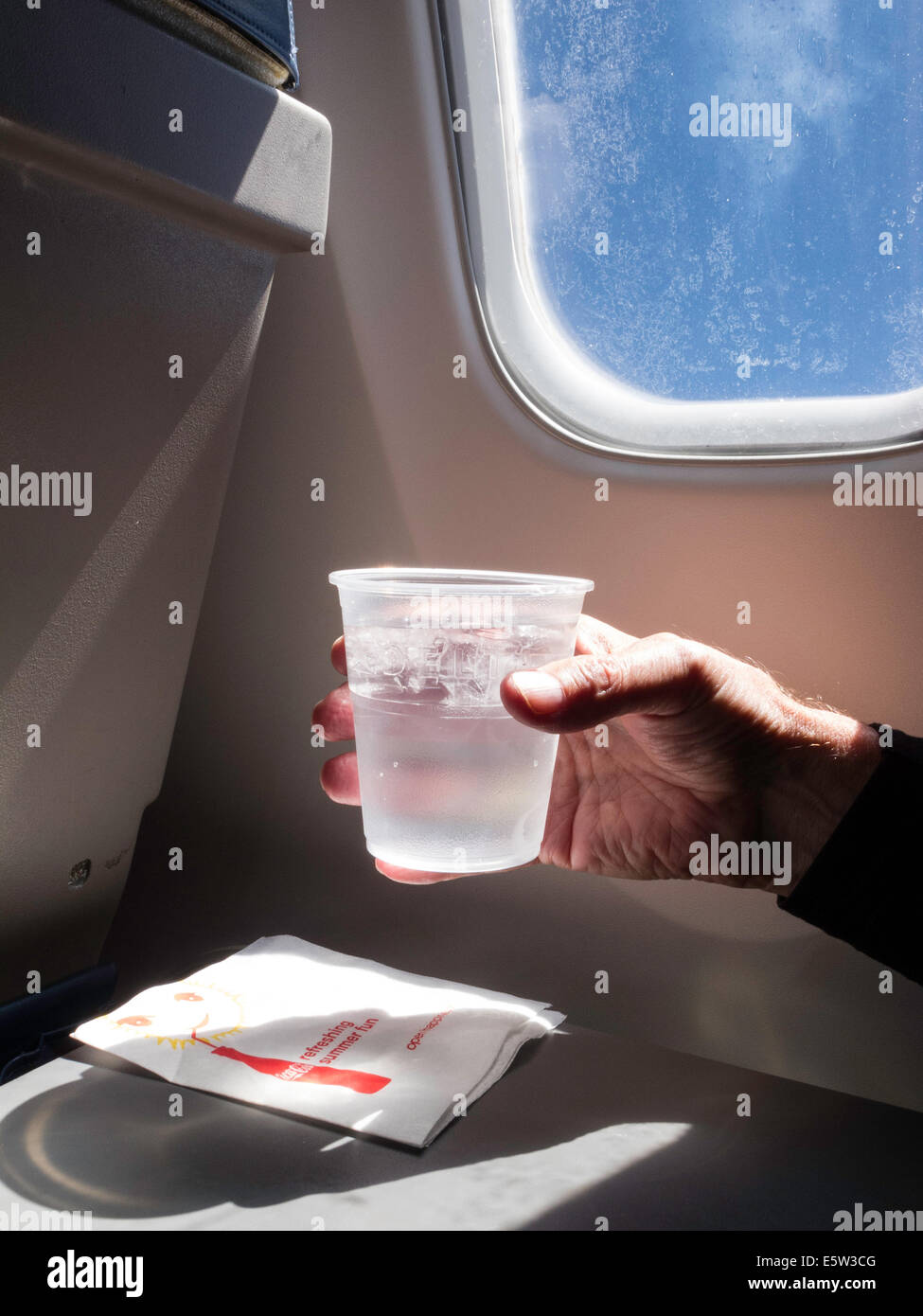 Plastic cup aboard airplane tray hi-res stock photography and images ...