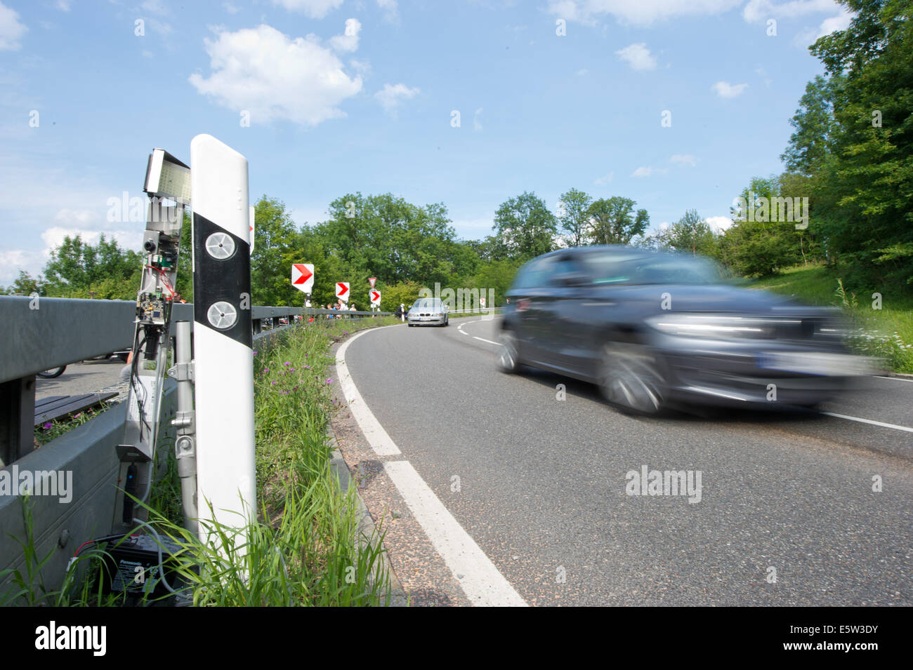 (ILLUSTRATION) A car drives past a prototype of the noise measurement ...