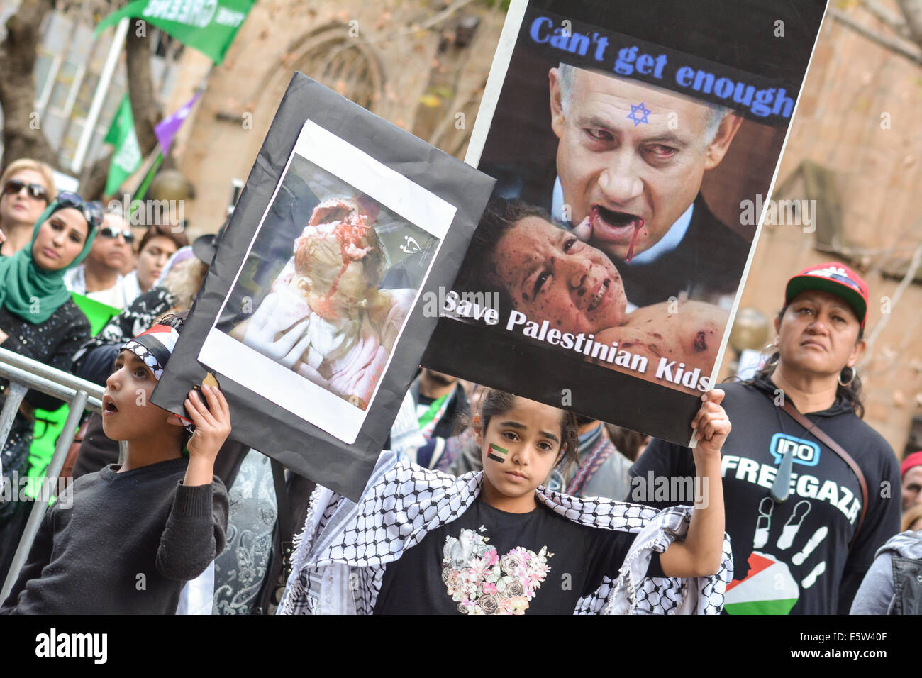 Children holds banners supporting Palestine during a rally against ...