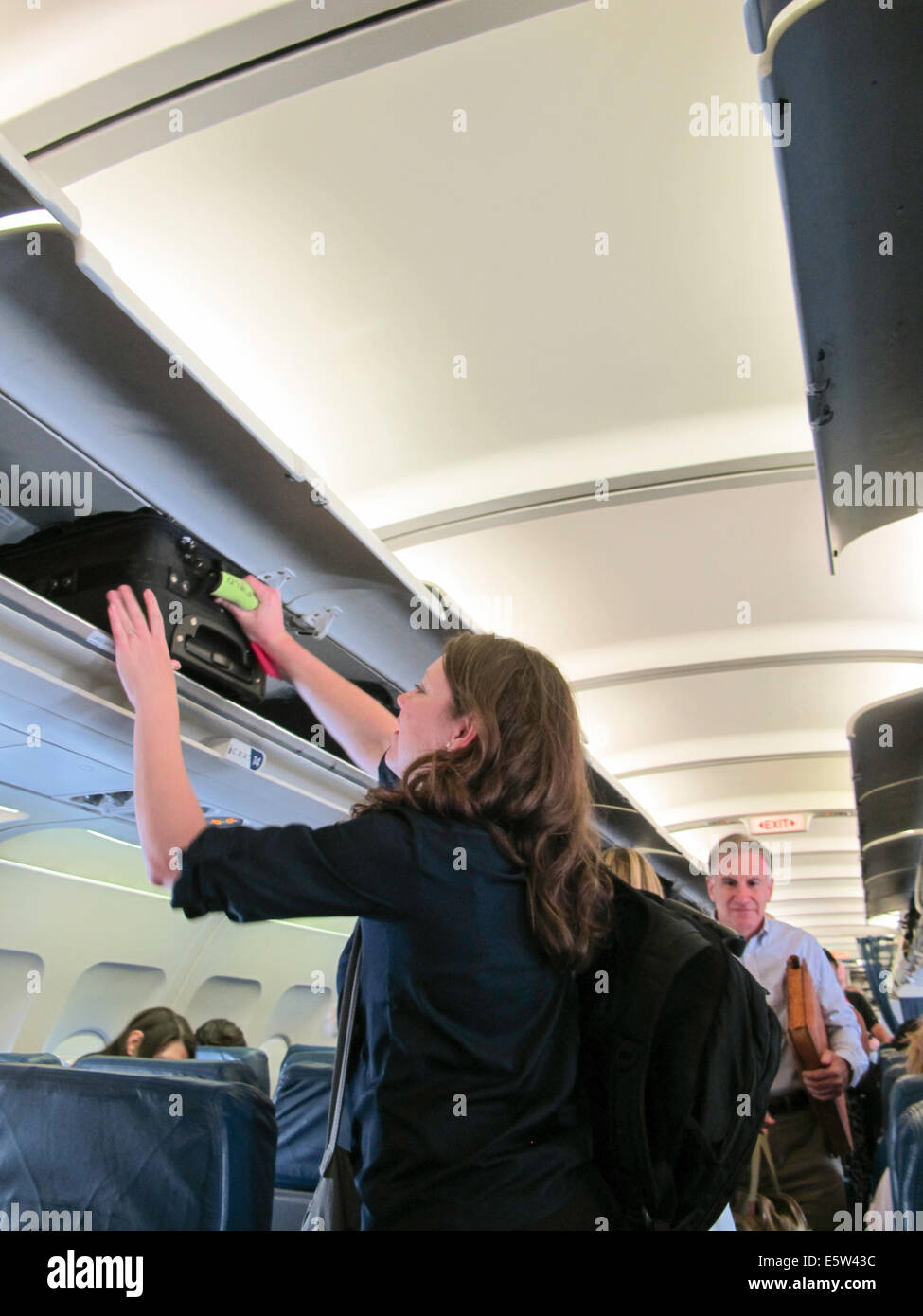 Overhead compartment airplane cabin interior hi-res stock photography ...
