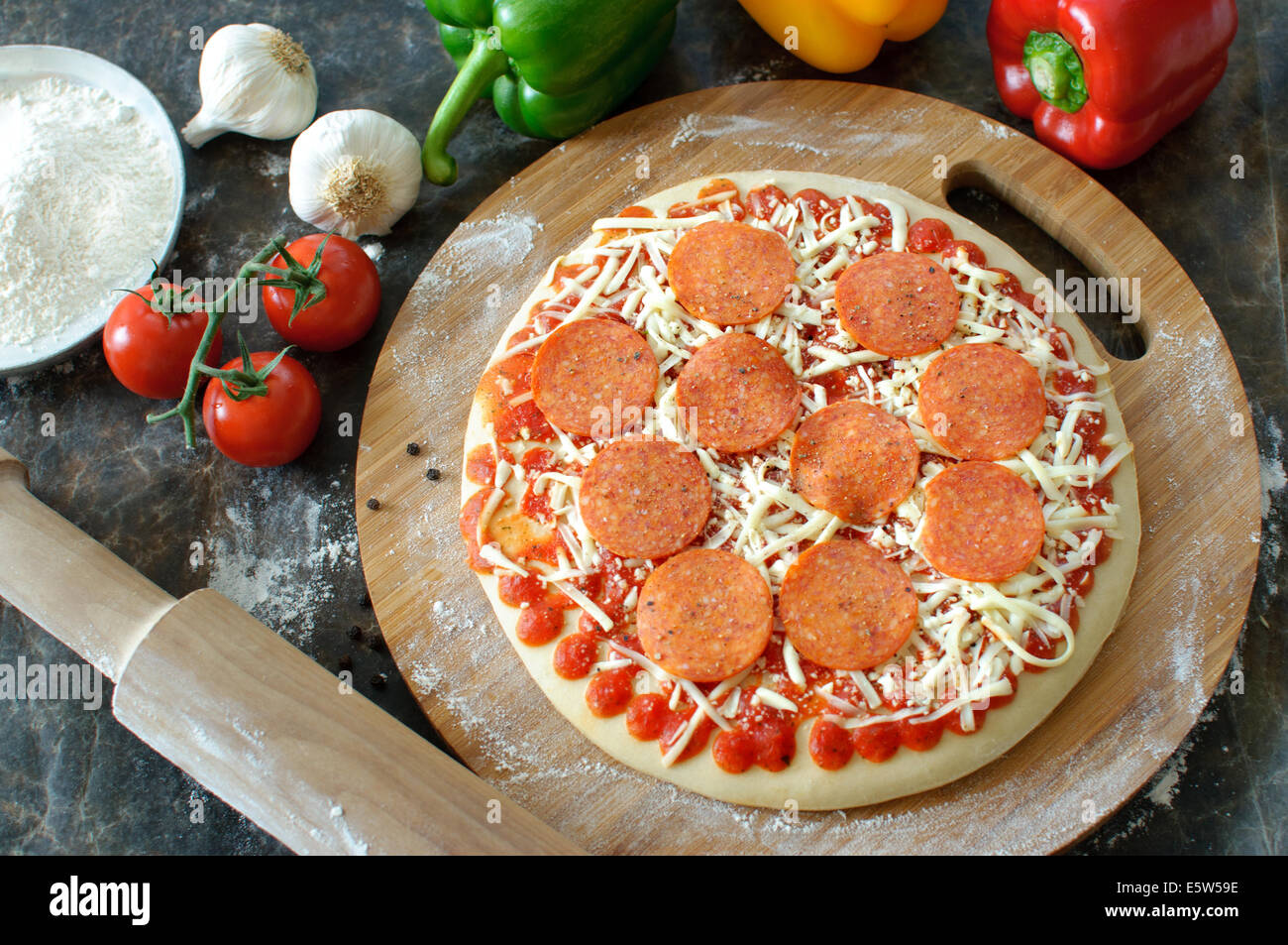 Pepperoni pizza preparation Stock Photo - Alamy