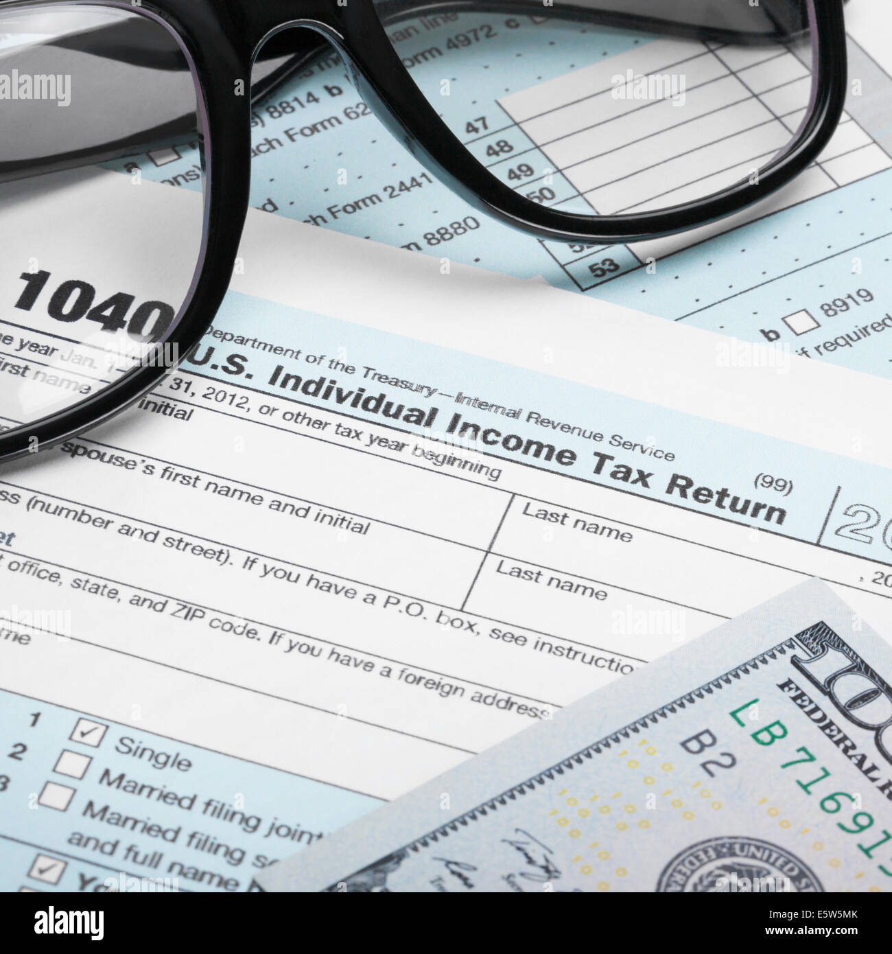 USA Tax Form 1040 with glasses and 100 US dollar bills - 1 to 1 ratio ...