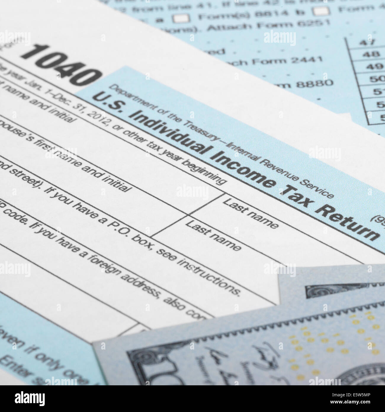 Tax Form 1040 with 100 US dollar bills - 1 to 1 ratio Stock Photo - Alamy