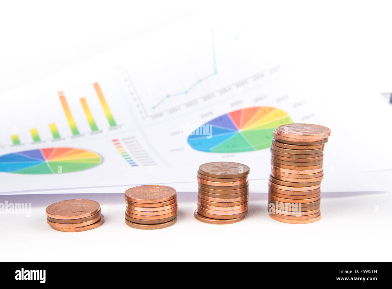 British pound coins and notes with financial chart Stock Photo - Alamy