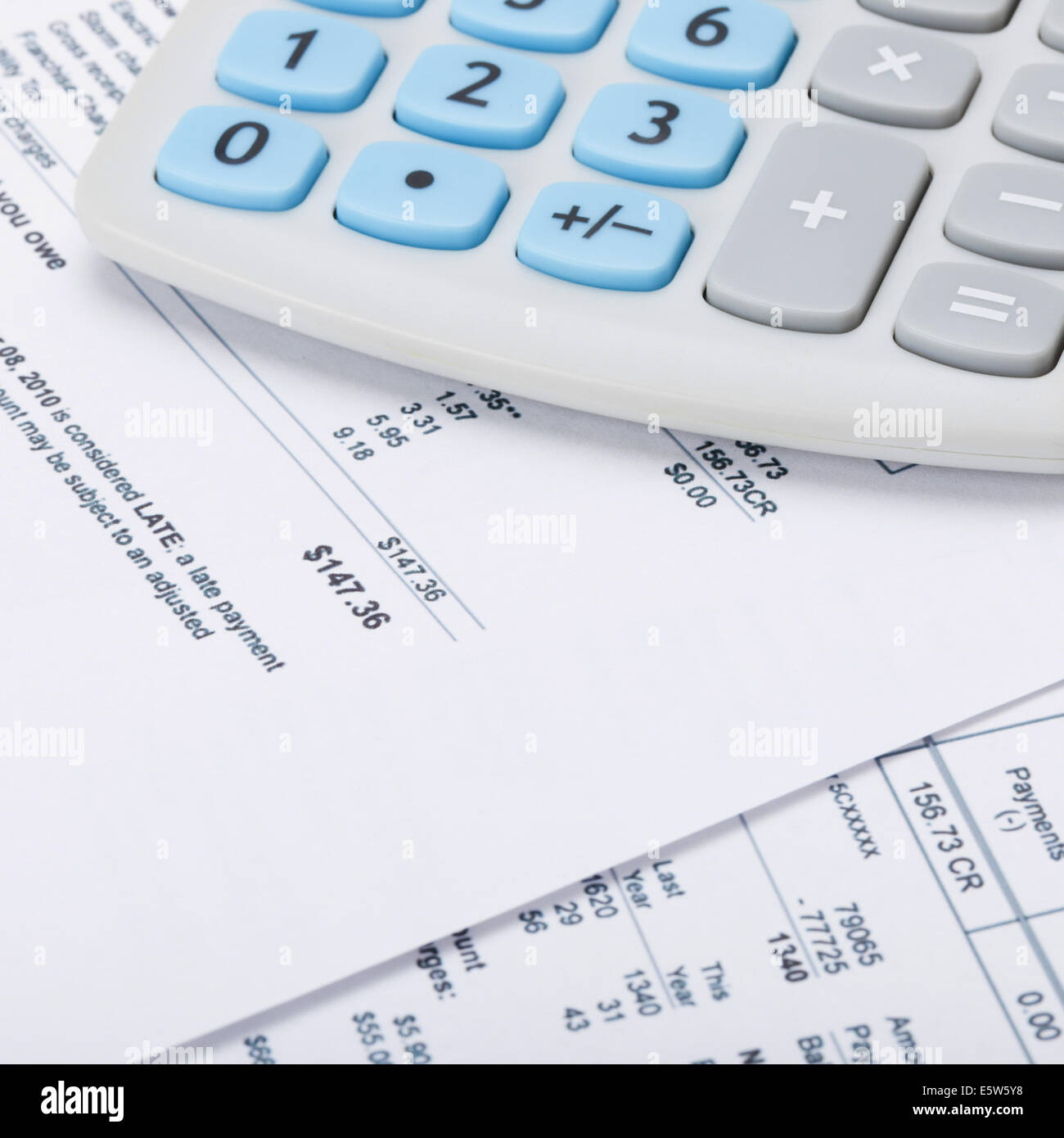 Receipt next to calculator - 1 to 1 ratio Stock Photo - Alamy