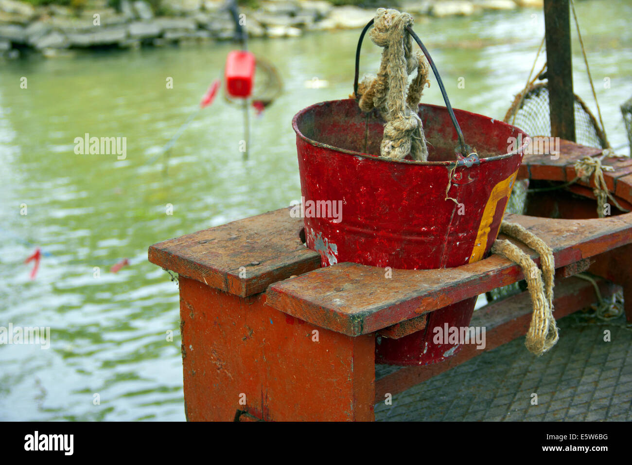 bucket with rope on the fishing Stock Photo - Alamy