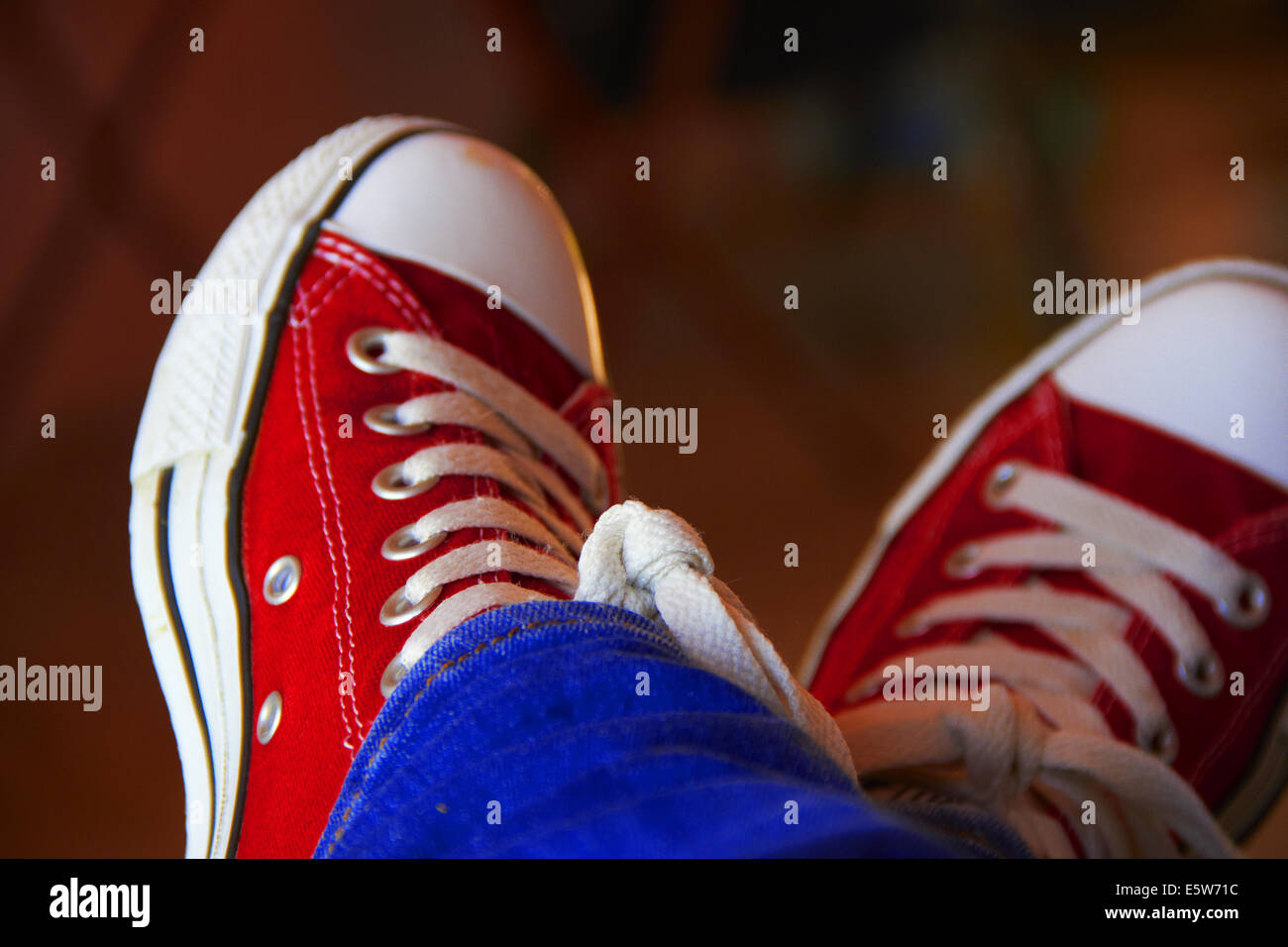 pair red sport shoes on foot Stock Photo - Alamy