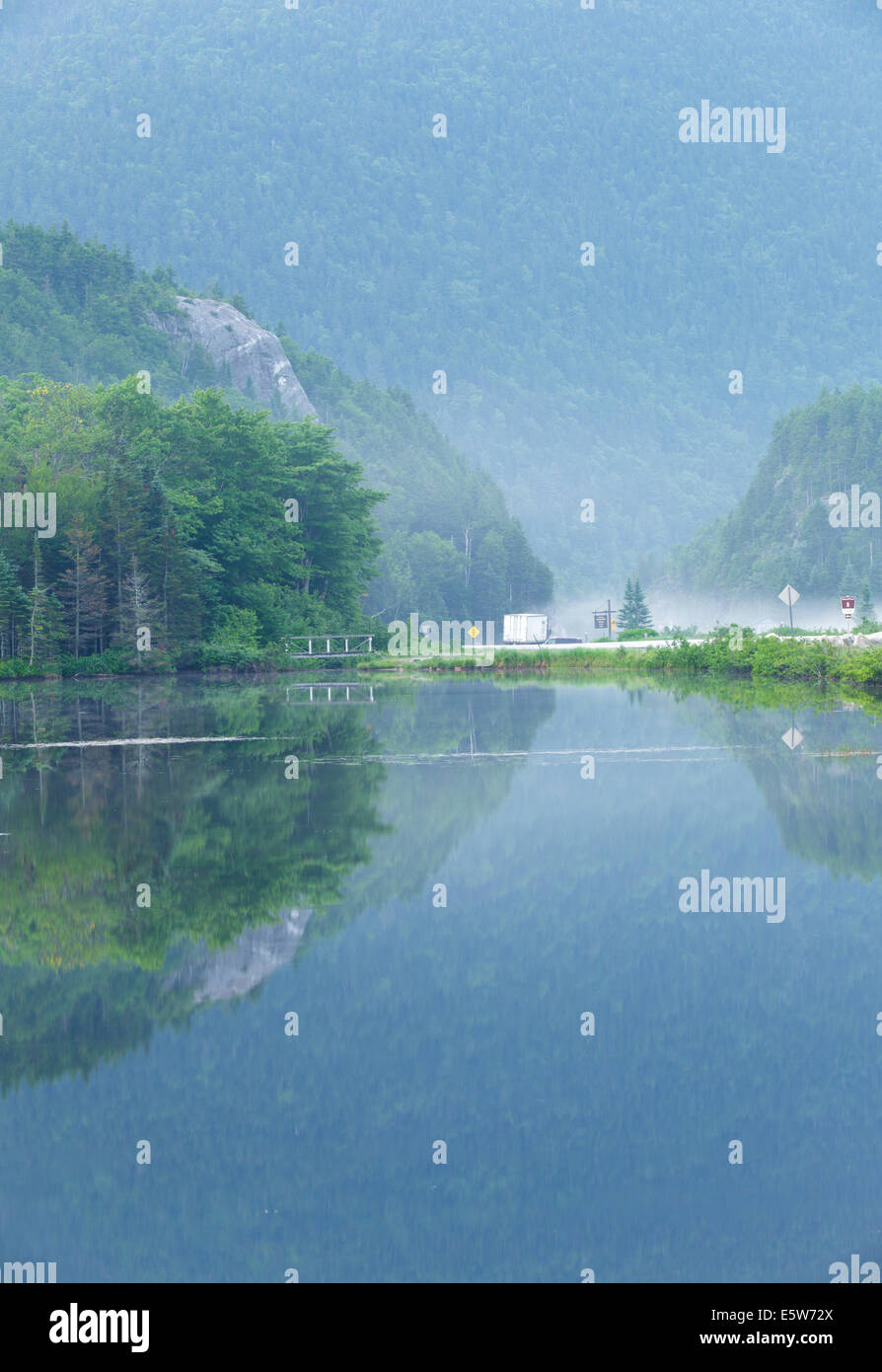 Reflection of Elephant Head rock profile in Saco Lake at the start of ...