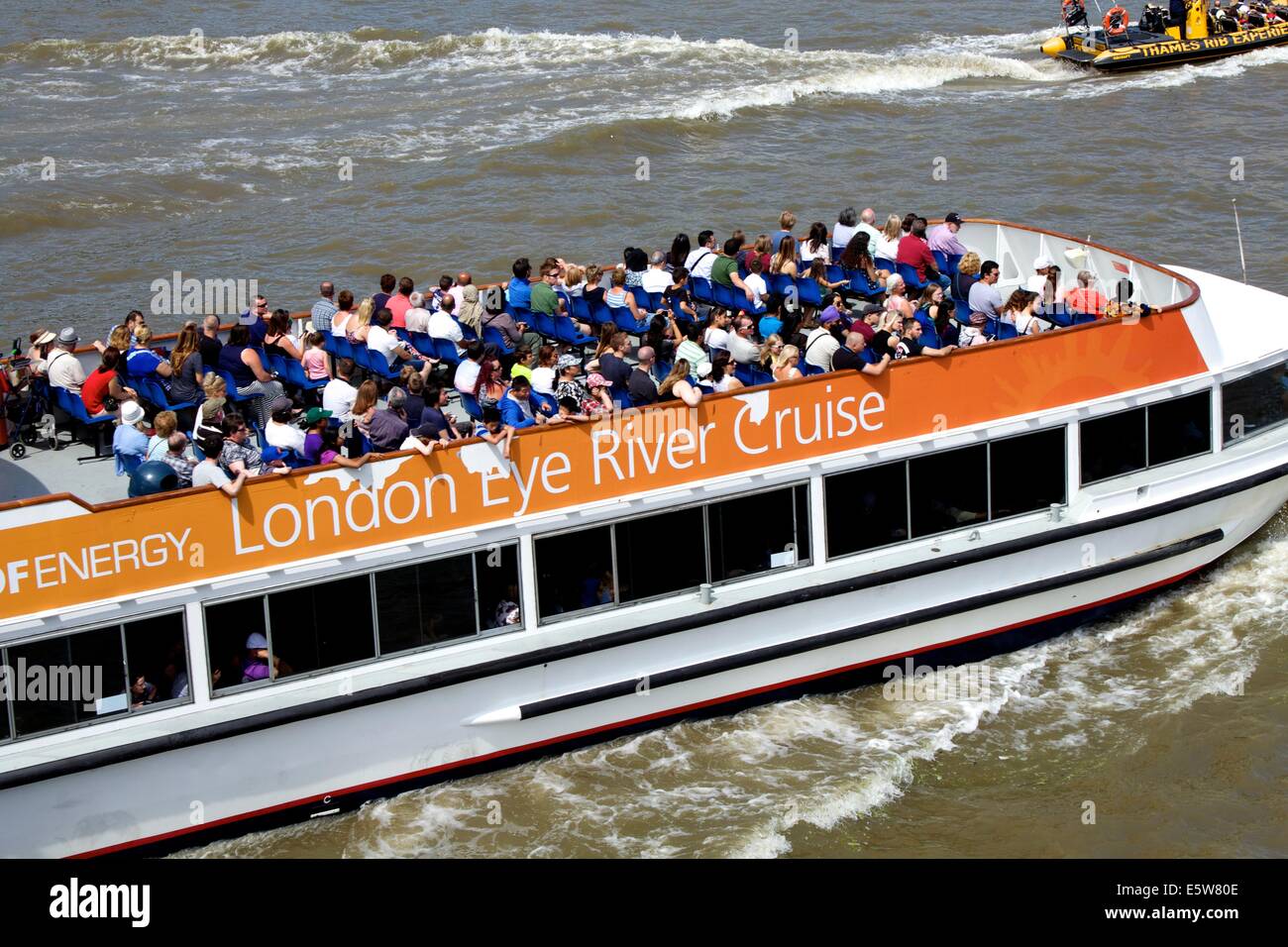 London Eye River cruise passing on the river thames Stock Photo - Alamy
