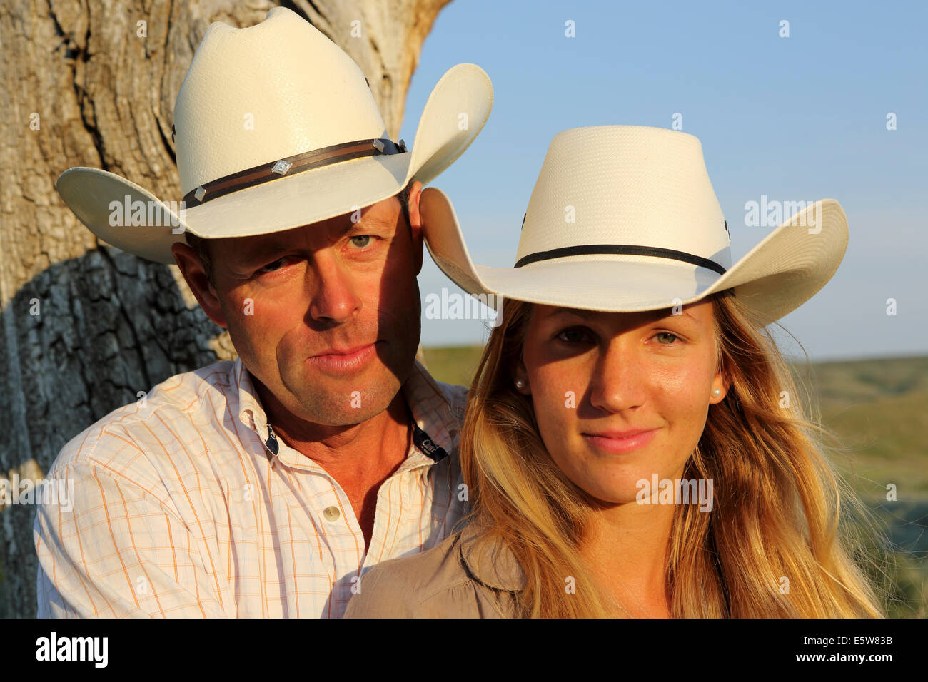 A cowboy and cowgirl at La Reata Ranch near Kyle, Saskatchewan, Canada ...