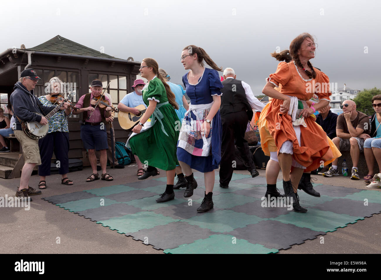 Folk dancers performing / busking on promenade during Sidmouth folk ...