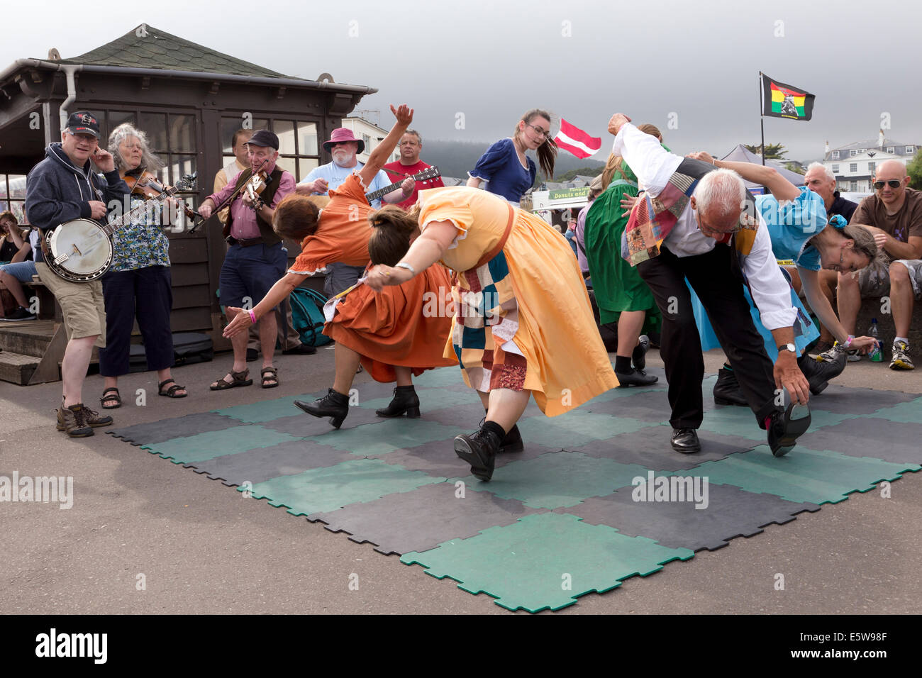 Folk dancers performing / busking on promenade during Sidmouth folk ...