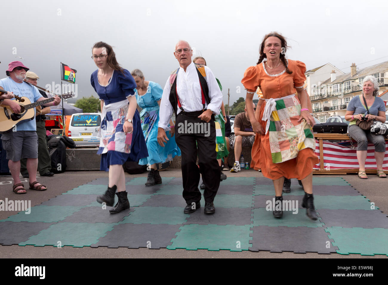 Folk dancers performing / busking on promenade during Sidmouth folk ...