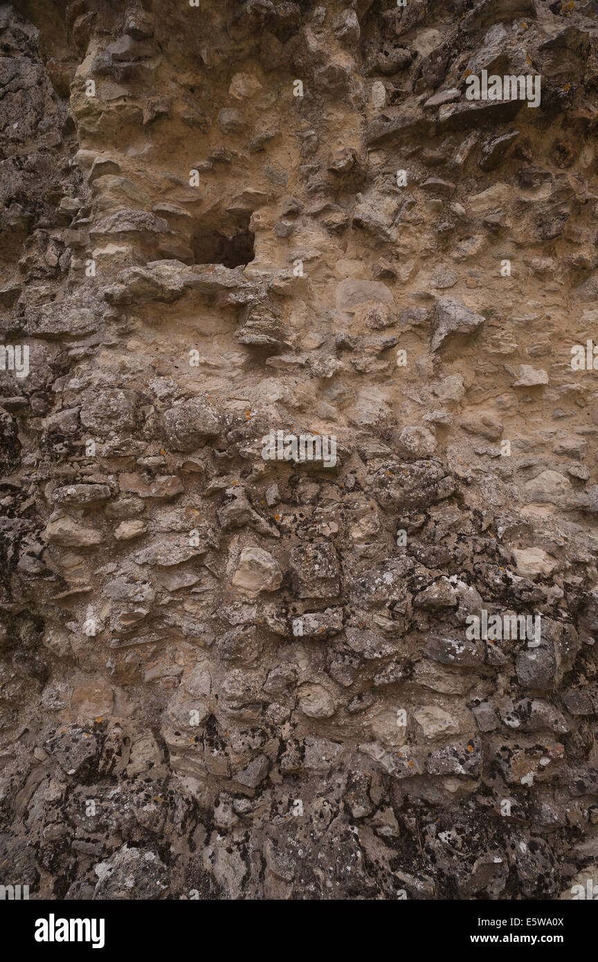medieval bricks and mortar part of a solid castle wall showing eroded ...