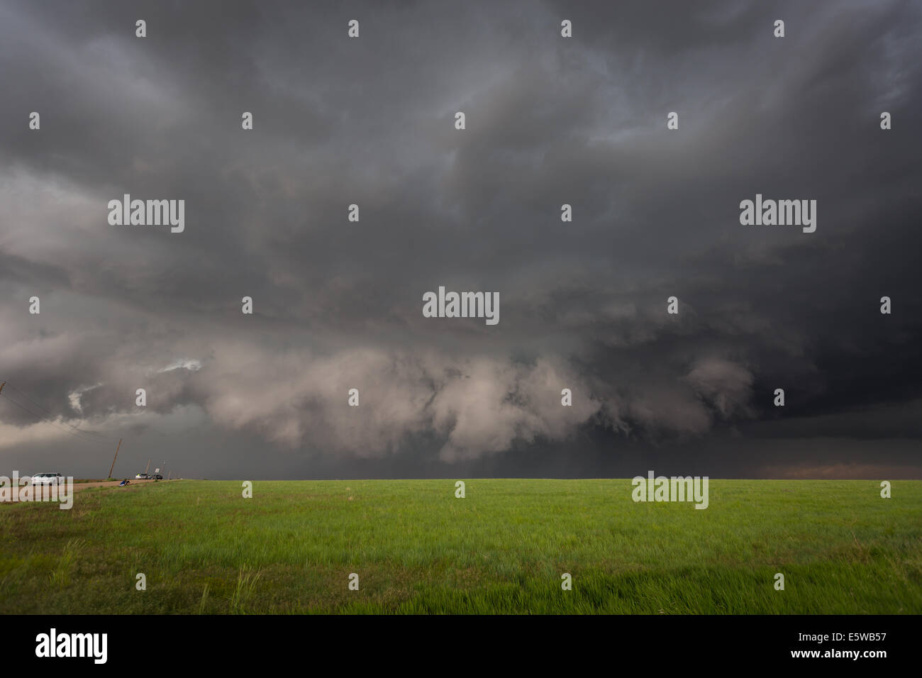 A tornado warned supercell thunderstorm rolls across the plains of ...