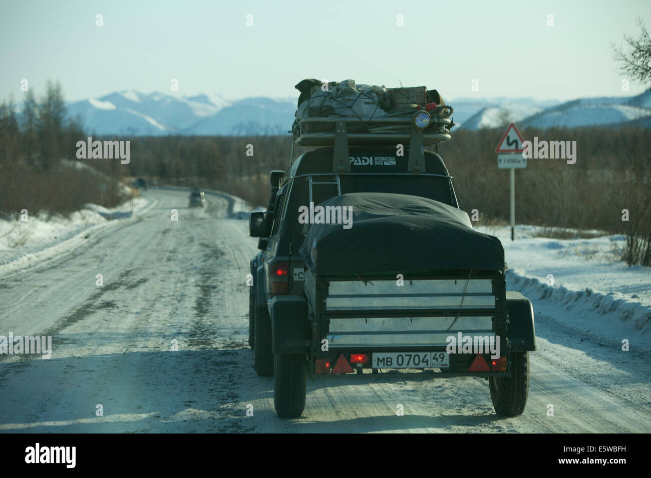 4WD expedition deserted snow road mountains Siberia Stock Photo - Alamy