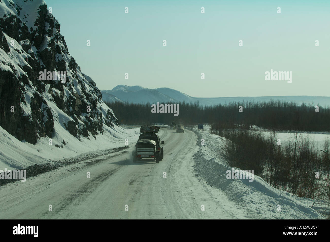 4WD expedition deserted snow road mountains Siberia Stock Photo - Alamy