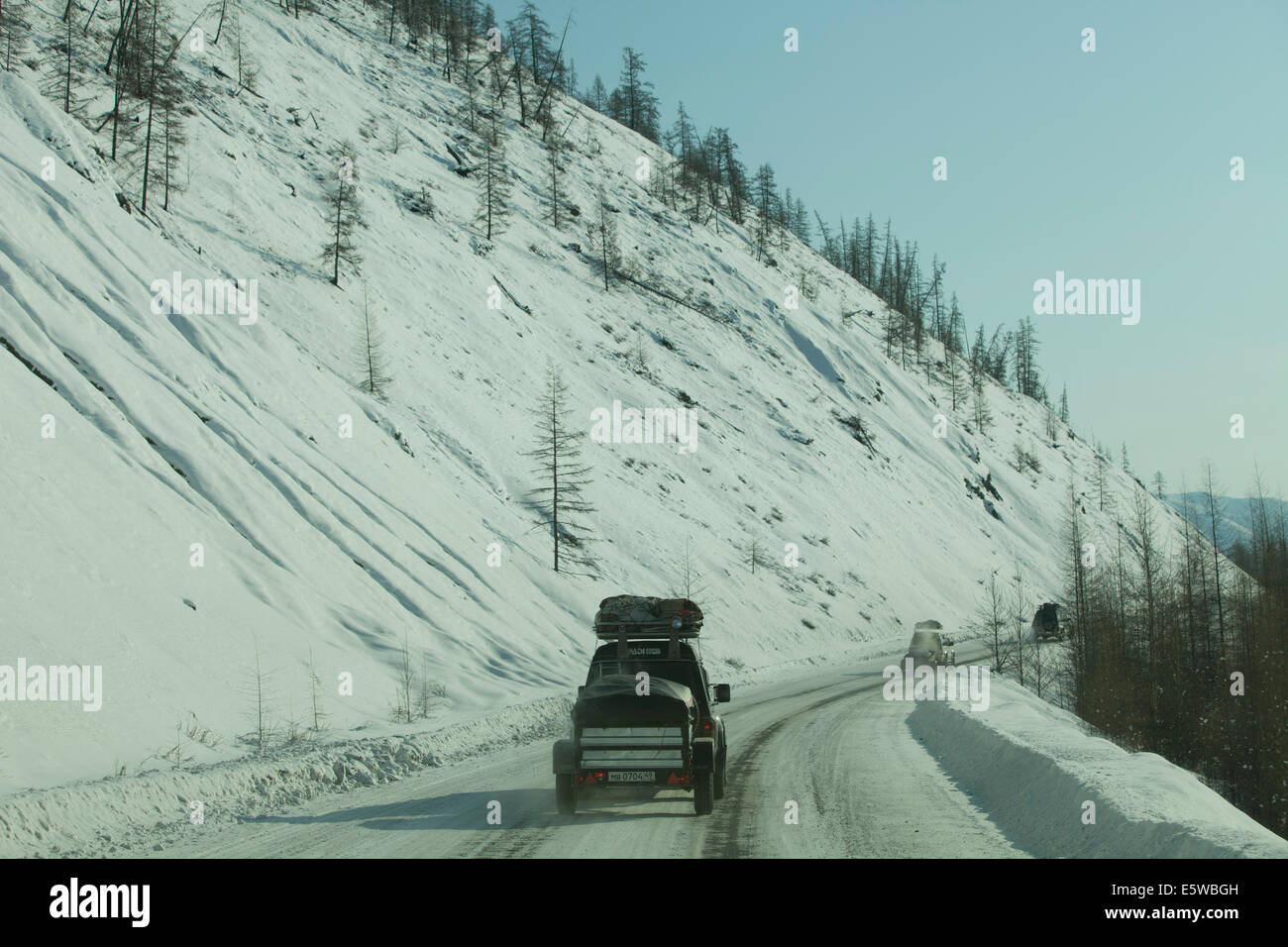 4WD expedition deserted snow road mountains Siberia Stock Photo - Alamy