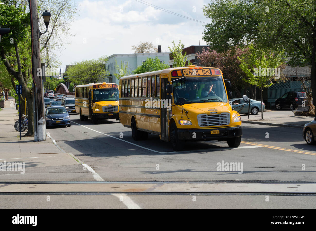 School buses stop at railroad intersection Stock Photo - Alamy