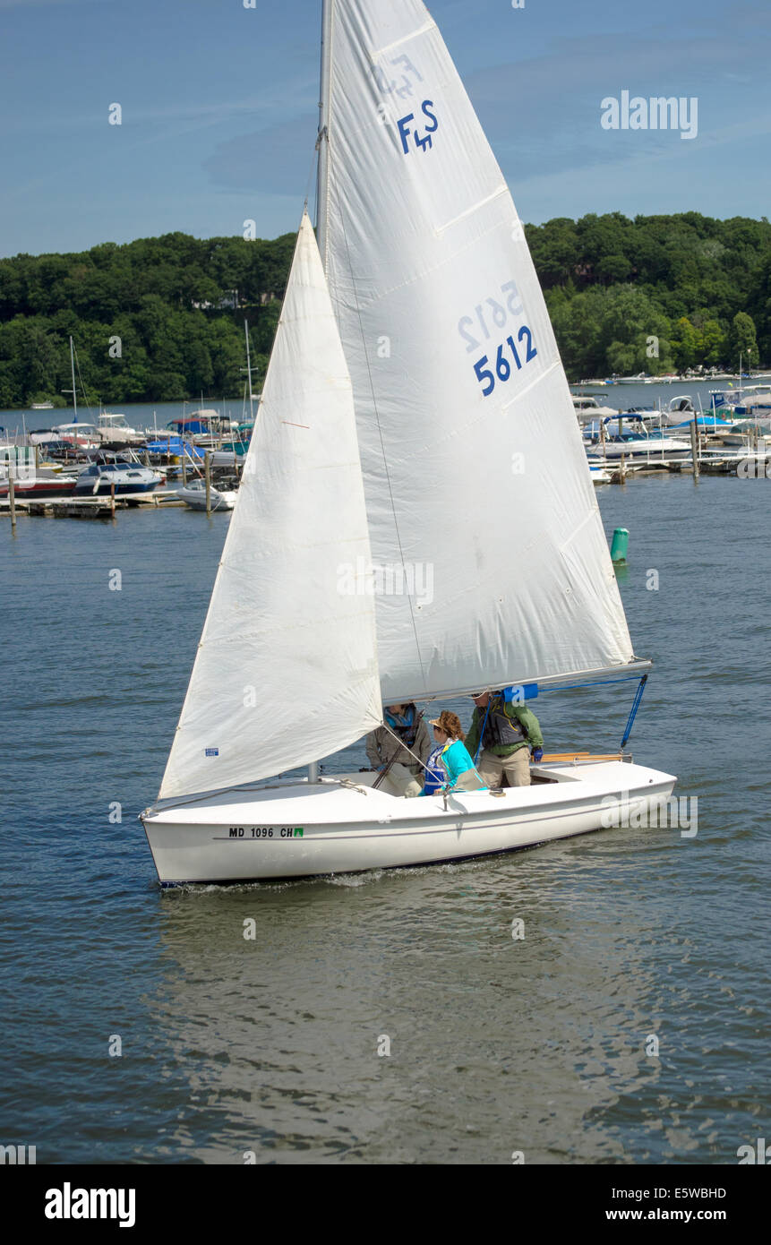 Sailer's set course in day sailer Stock Photo - Alamy