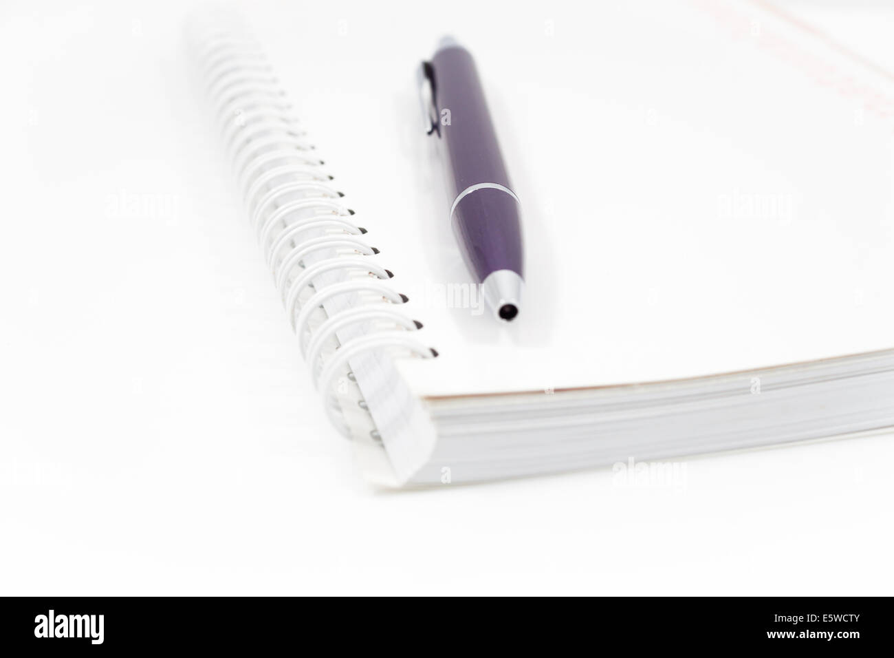 Spiral notebook with pen isolated on white background, stock photo ...