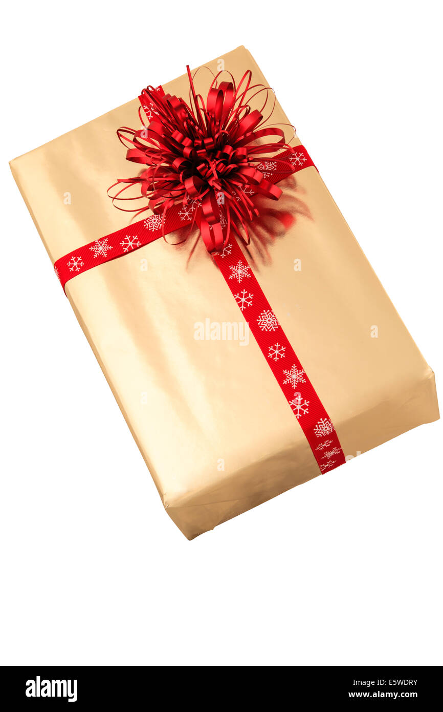 A present wrapped in gold and tied with a red ribbon Stock Photo - Alamy