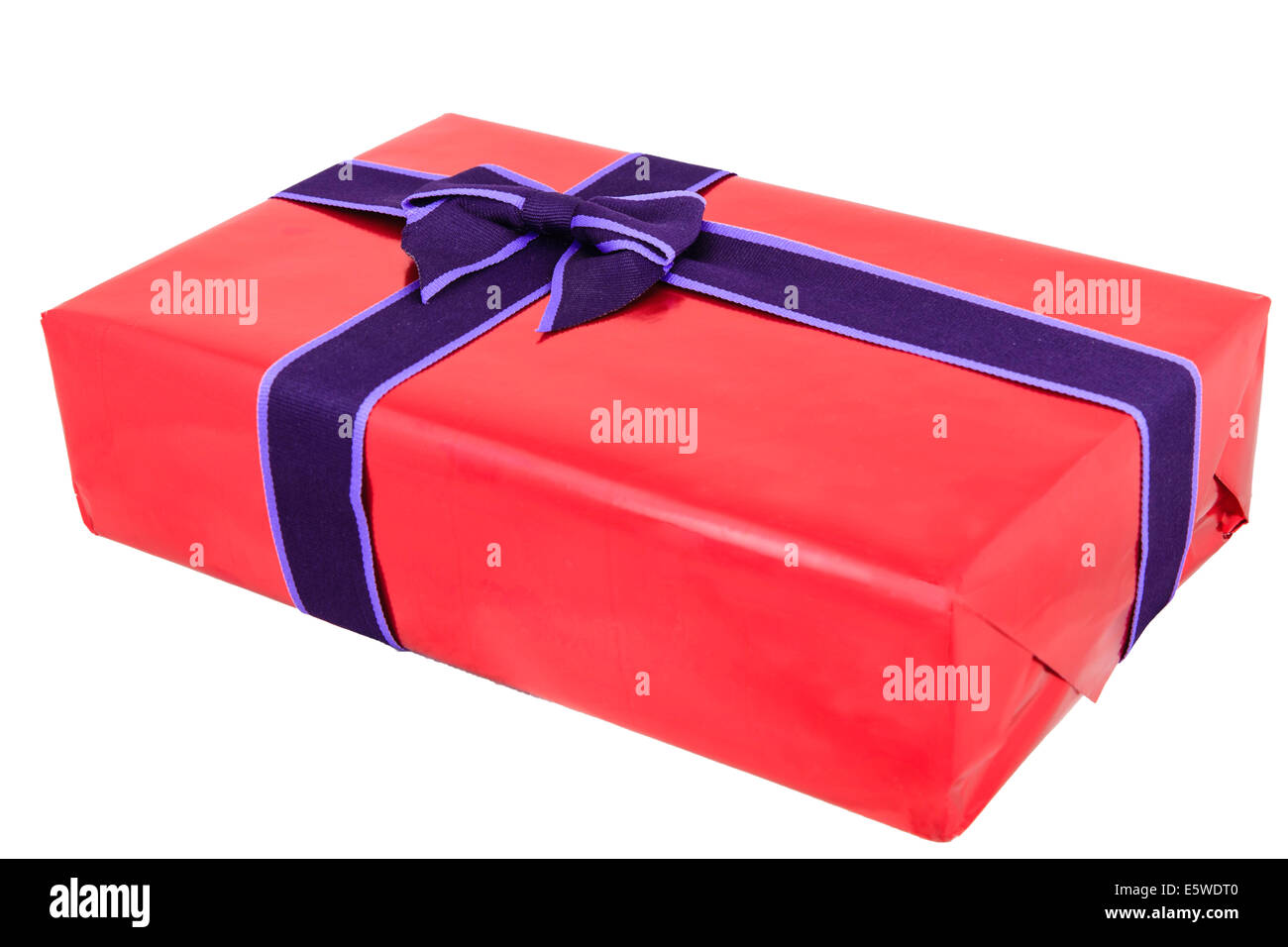 Present wrapped in red with blue ribbon Stock Photo - Alamy