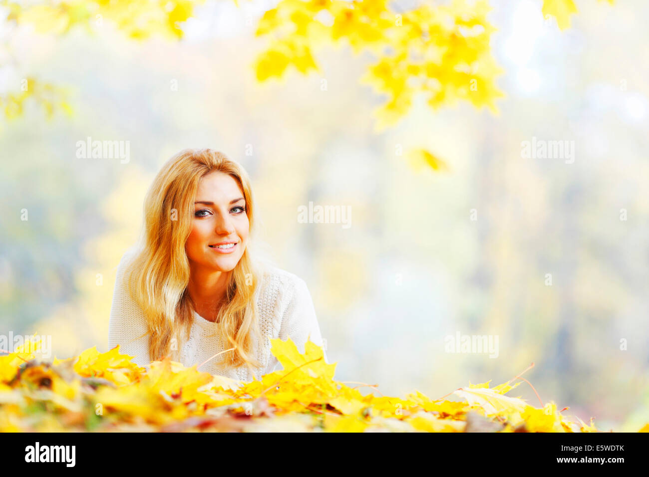 Young woman laying on ground hi-res stock photography and images - Alamy
