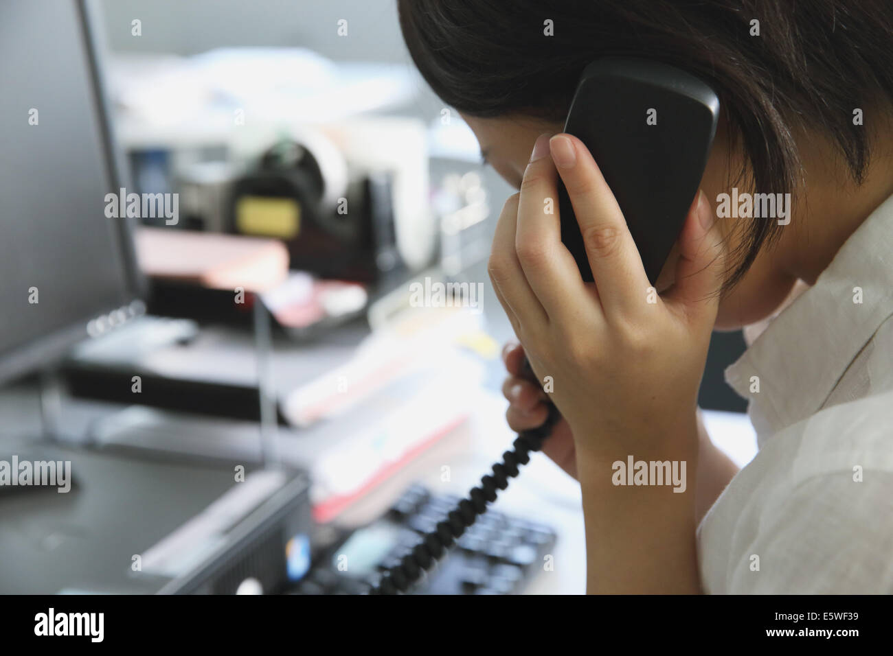 Japanese young businesswoman depressed at her office desk Stock Photo ...