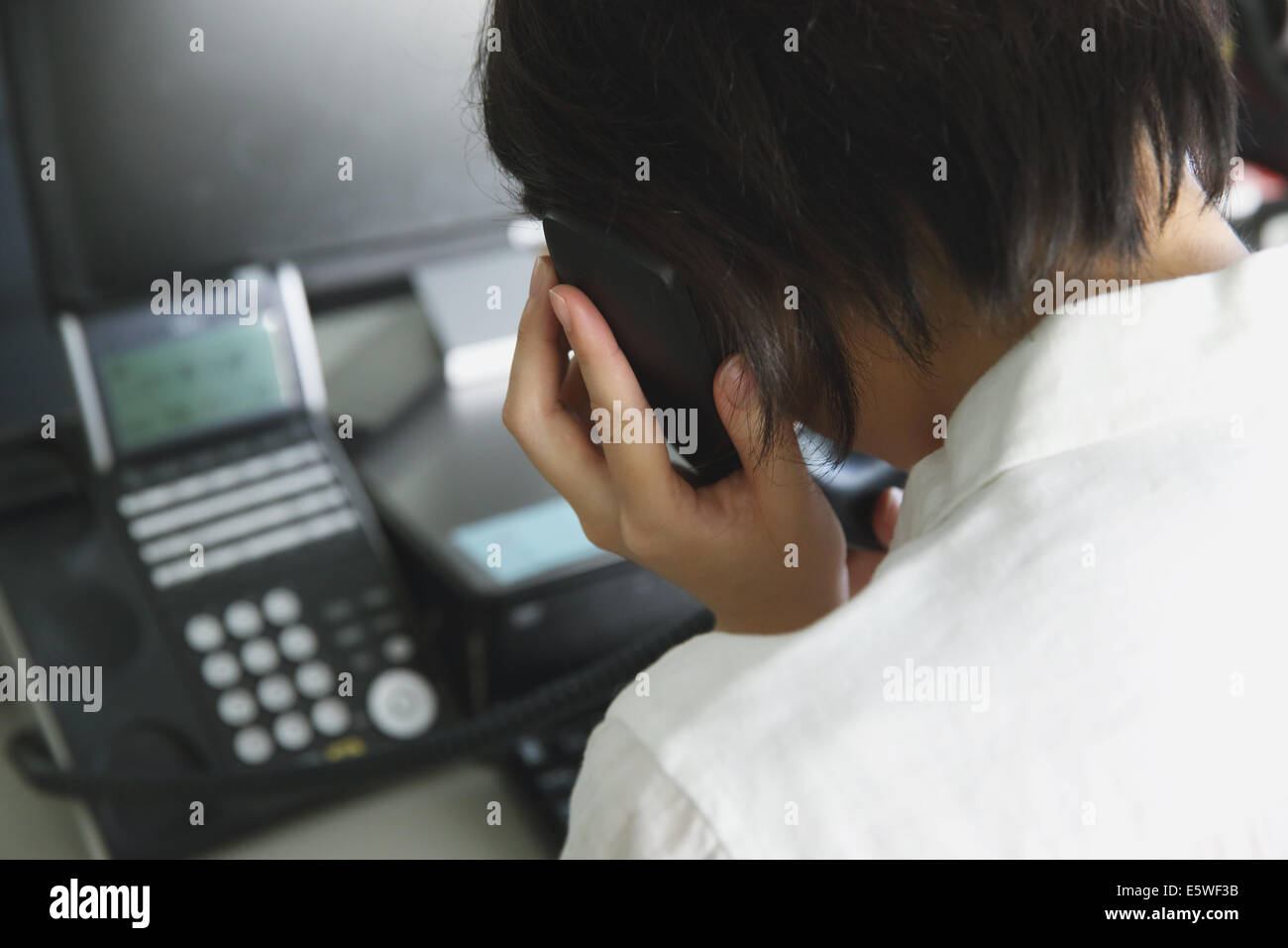 Japanese young businesswoman depressed at her office desk Stock Photo ...