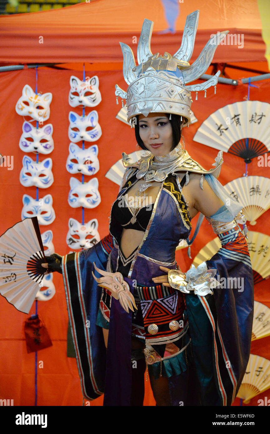 Handan, China. 6th Aug, 2014. A fan of cosplay poses for a photo during ...