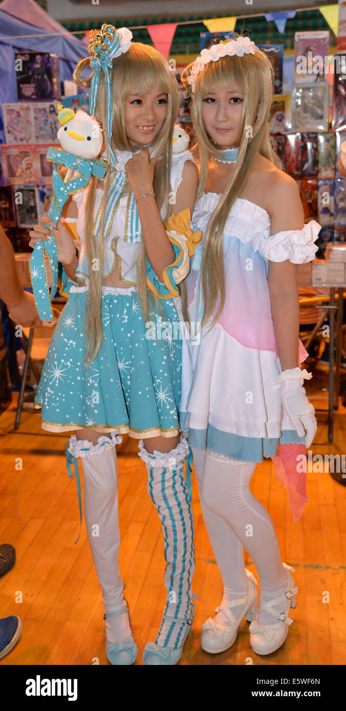 Handan, China. 6th Aug, 2014. A fan of cosplay poses for a photo during ...