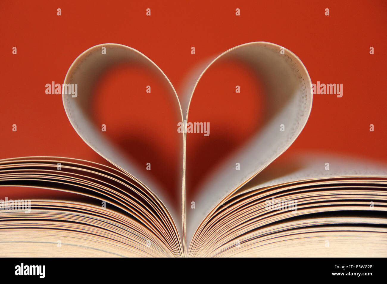 Book pages, heart-shaped Stock Photo - Alamy