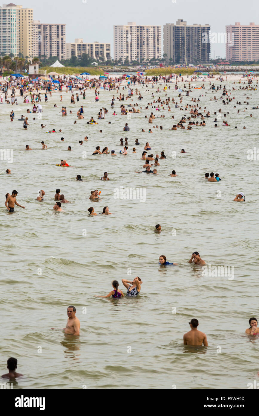 Clearwater, Florida, USA - Swimmers and people in sea off the crowded ...