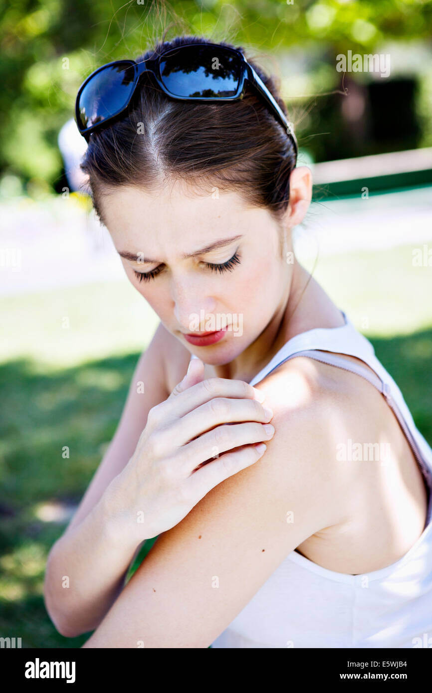 Itching in a woman Stock Photo - Alamy